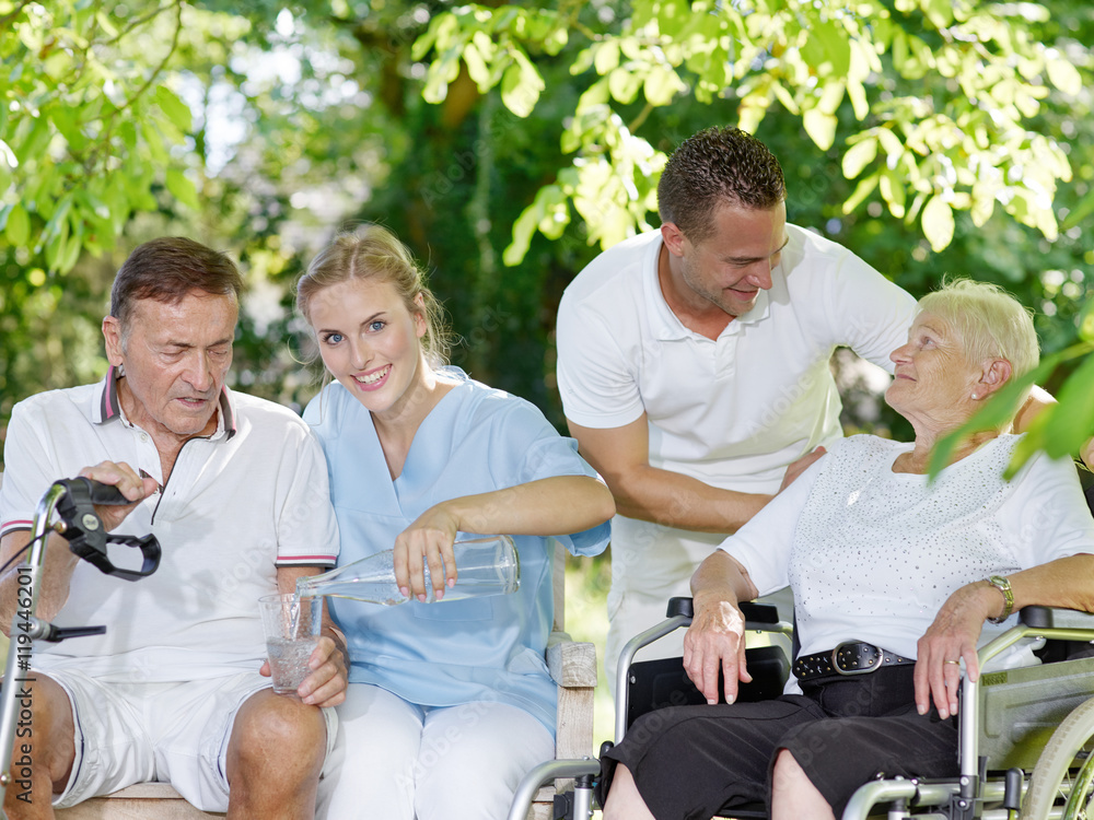 Elderly people and nursing staff Stock Photo | Adobe Stock