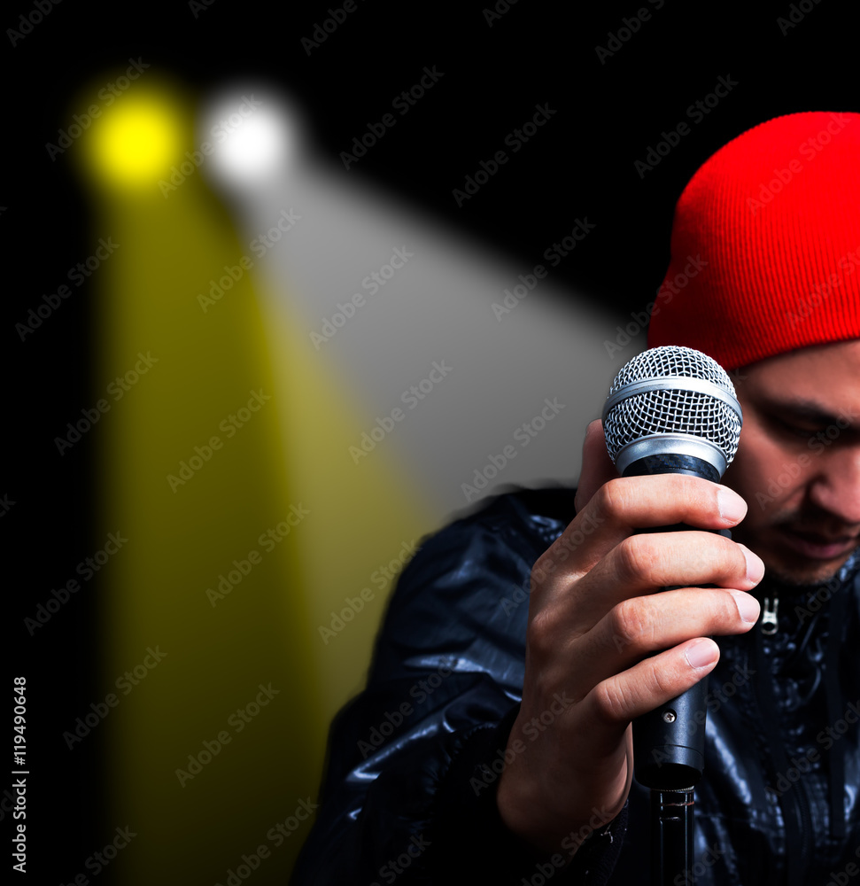 asian male singer singing in concert with spotlight background Stock ...