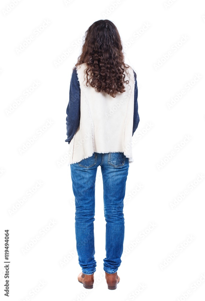back view of standing young beautiful woman. Long-haired girl with ...