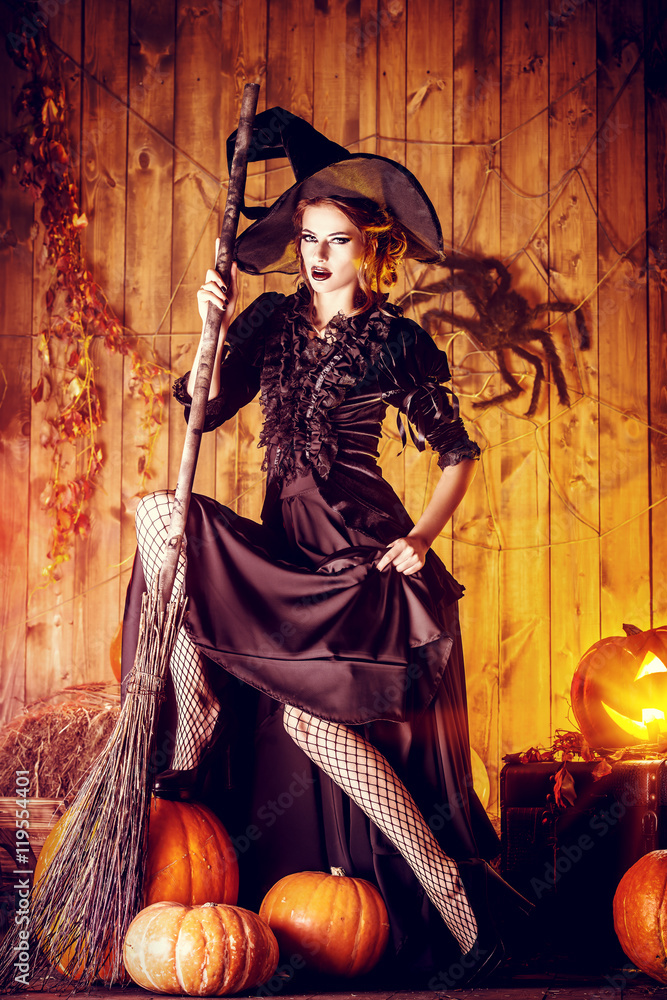 elegant witch with broomstick Stock Photo | Adobe Stock