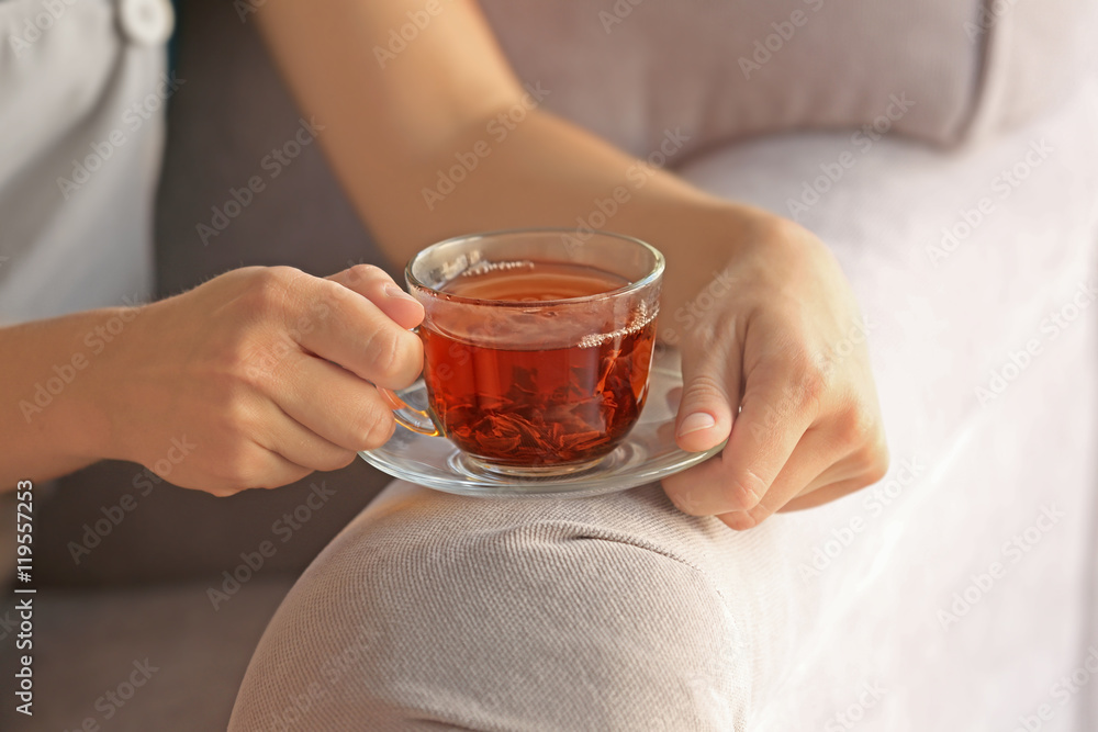 Woman holding cup of tea Stock Photo | Adobe Stock