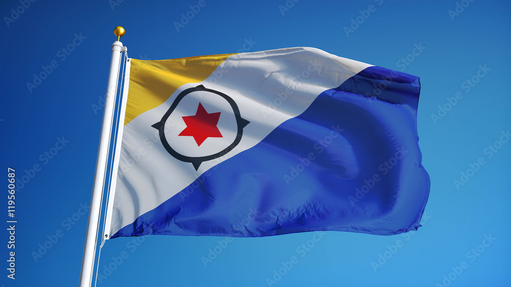 Bonaire flag waving against clean blue sky, close up, isolated with ...