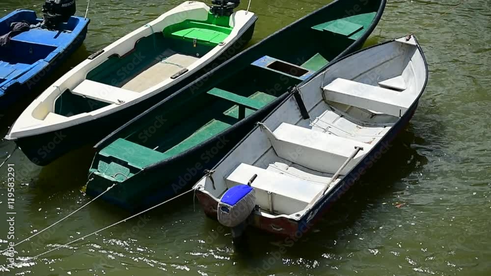 Fishing boats tied together next to a pier Stock Video | Adobe Stock