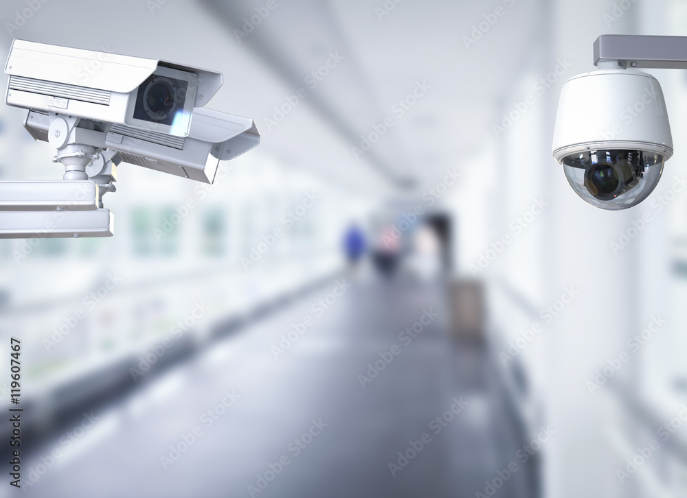 cctv camera or security camera on corridor background Stock Photo ...