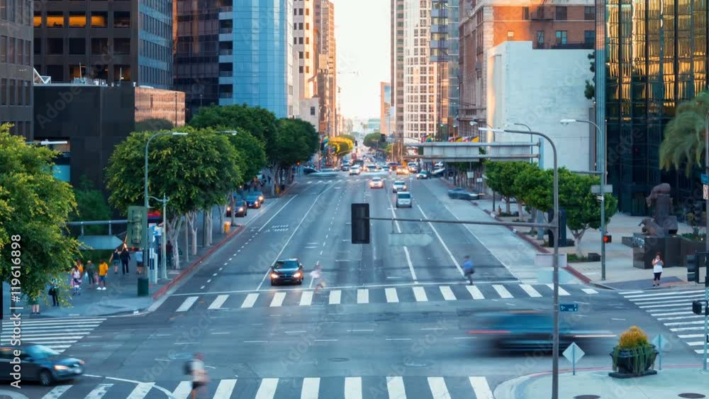 Time-lapse of traffic and people at a busy intersection in Downtown Los ...