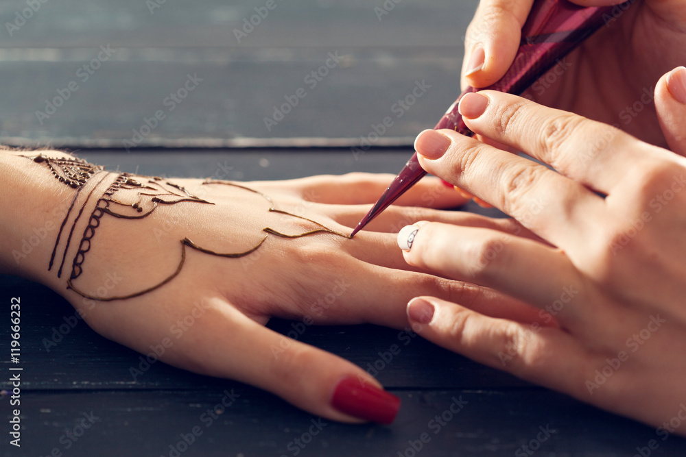 Process of applying mehndi on female hands Stock Photo | Adobe Stock