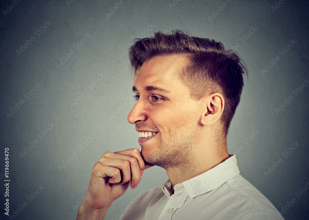 Side view of handsome happy man daydreaming Stock Photo | Adobe Stock