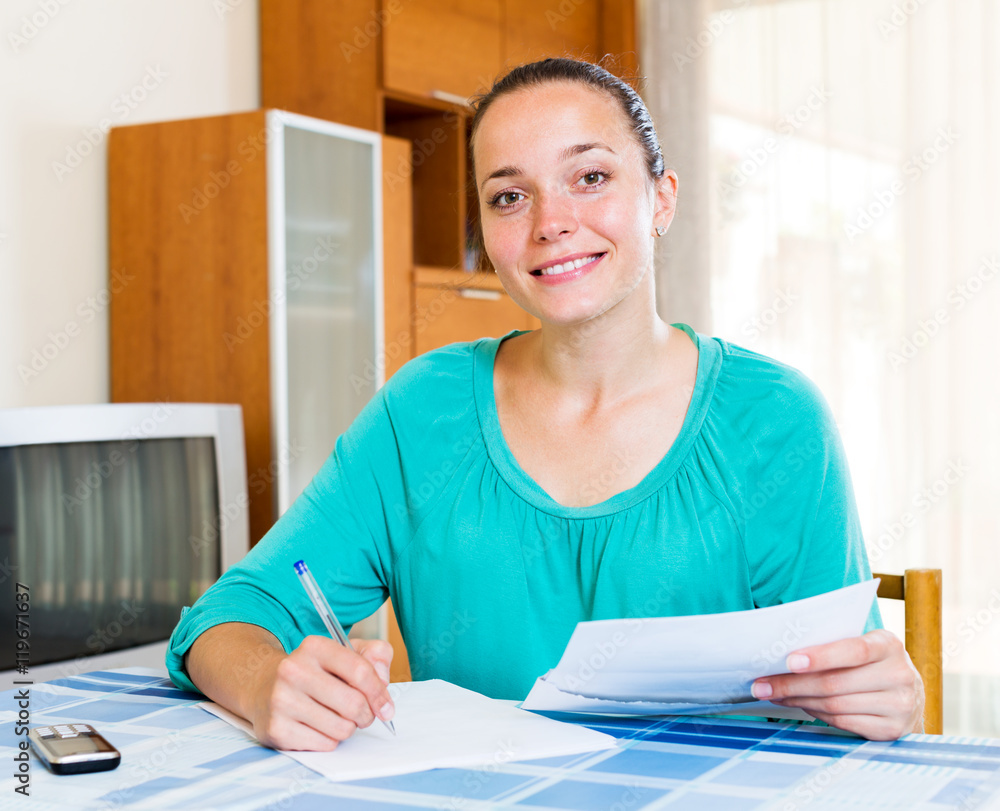 girl filling out tax forms Stock Photo | Adobe Stock
