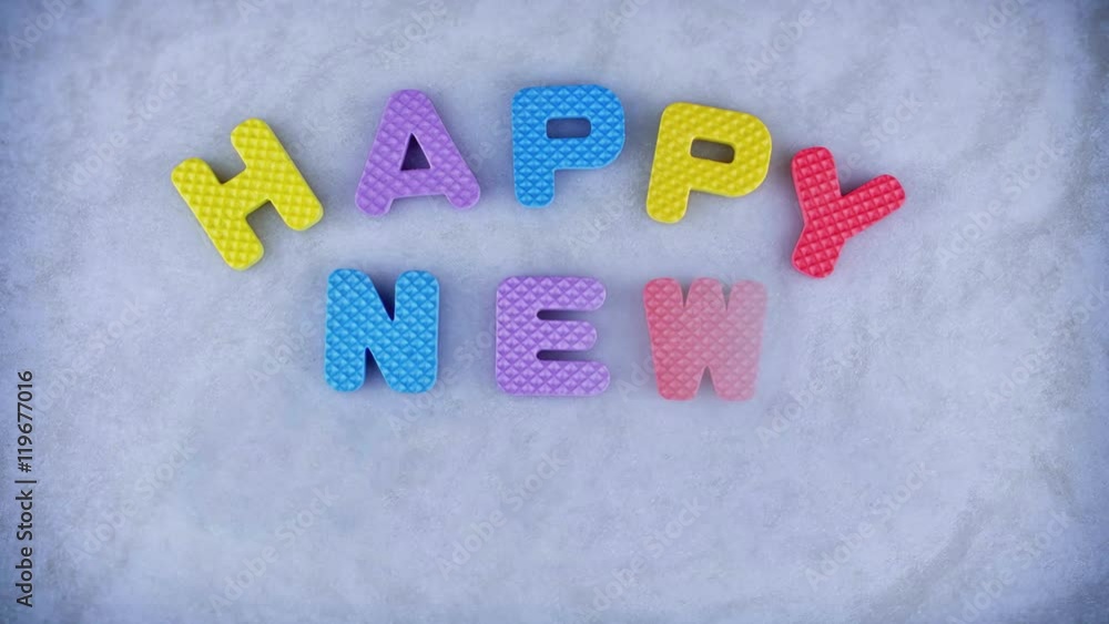 Words Happy New Year appearing letter by letter with the blue texture ...