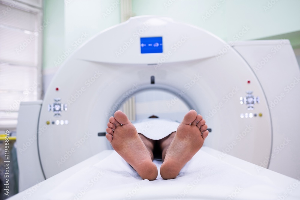 Patient lying on mri machine Stock Photo | Adobe Stock