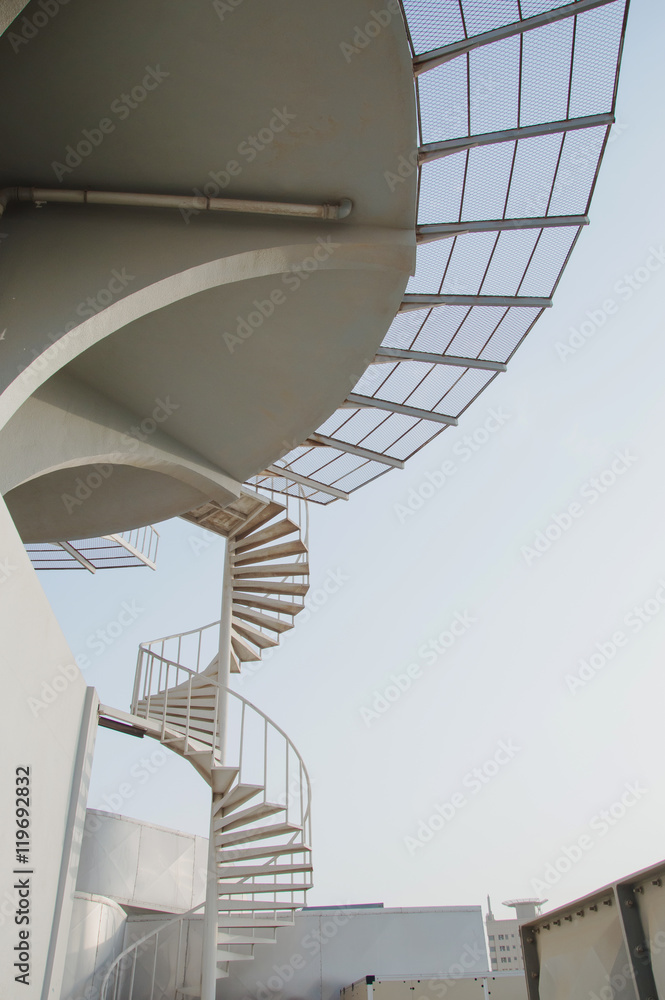 Vertical photo of helipad with highr stairs on the roof of a building ...