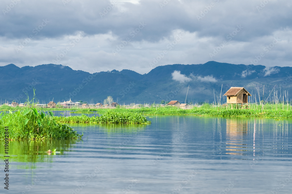 Wooden houses on piles inhabited by the tribe of Inthar, Inle Lake ...