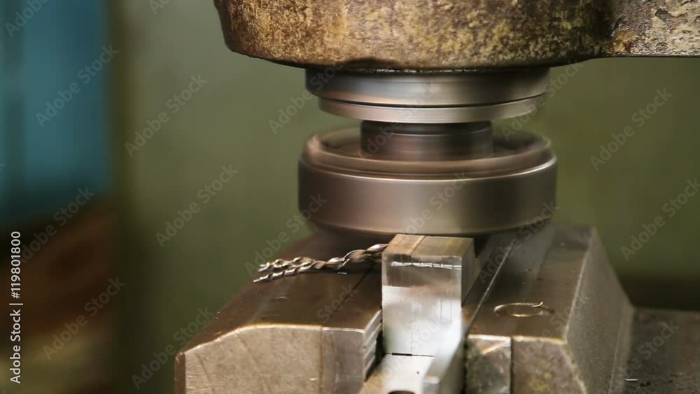 Turning lathe in action.Facing operation of a metal blank on turning ...