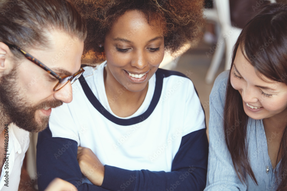 Young students meeting and having fun at university canteen over coffee ...