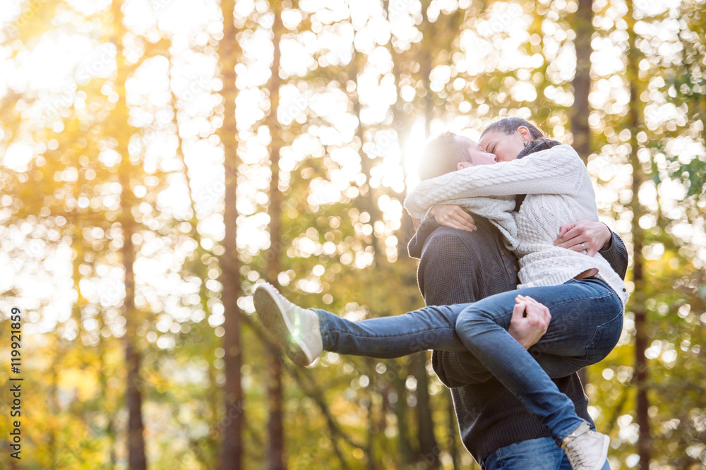 Couple in love, man carrying woman in his arms Stock Photo | Adobe Stock