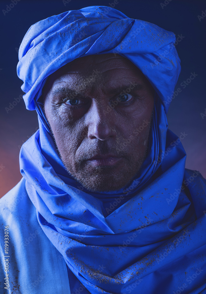 Berber man in night light wearing blue turban with white robe. S Stock ...