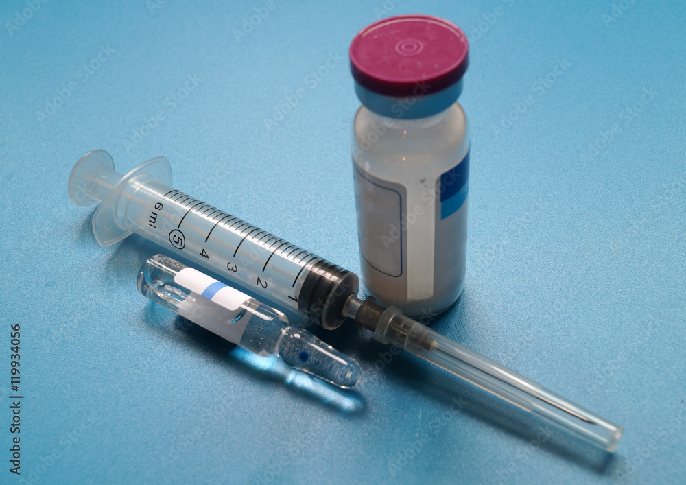 Vial, an ampoule and syringe for injection. Stock Photo | Adobe Stock