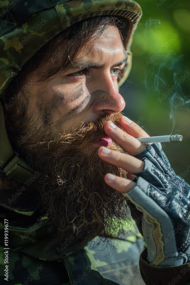 Soldier smoking cigarette Stock Photo | Adobe Stock