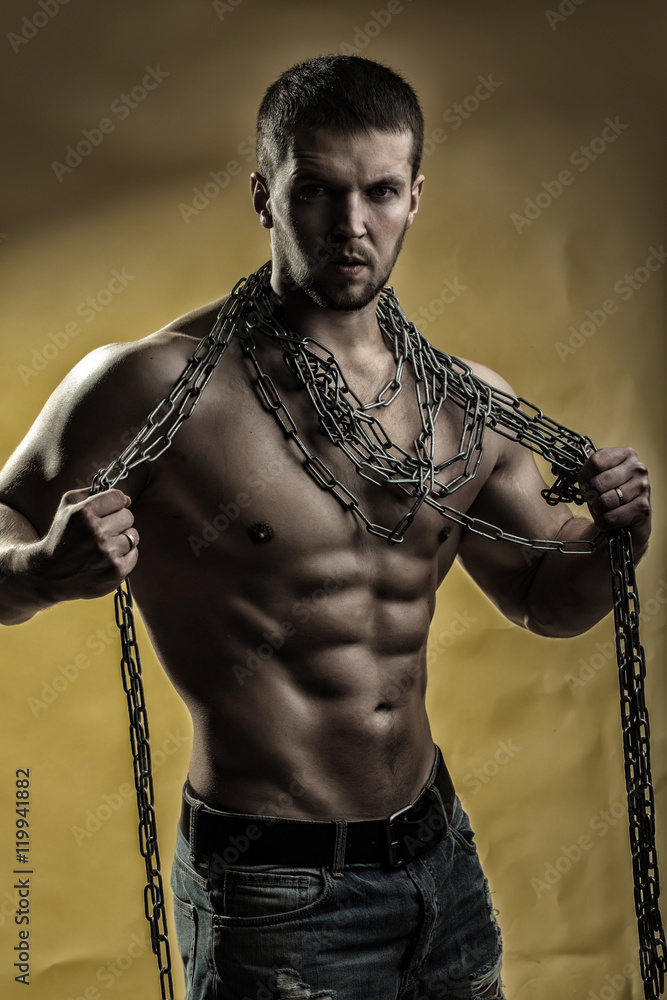 Muscular man with rope Stock Photo | Adobe Stock
