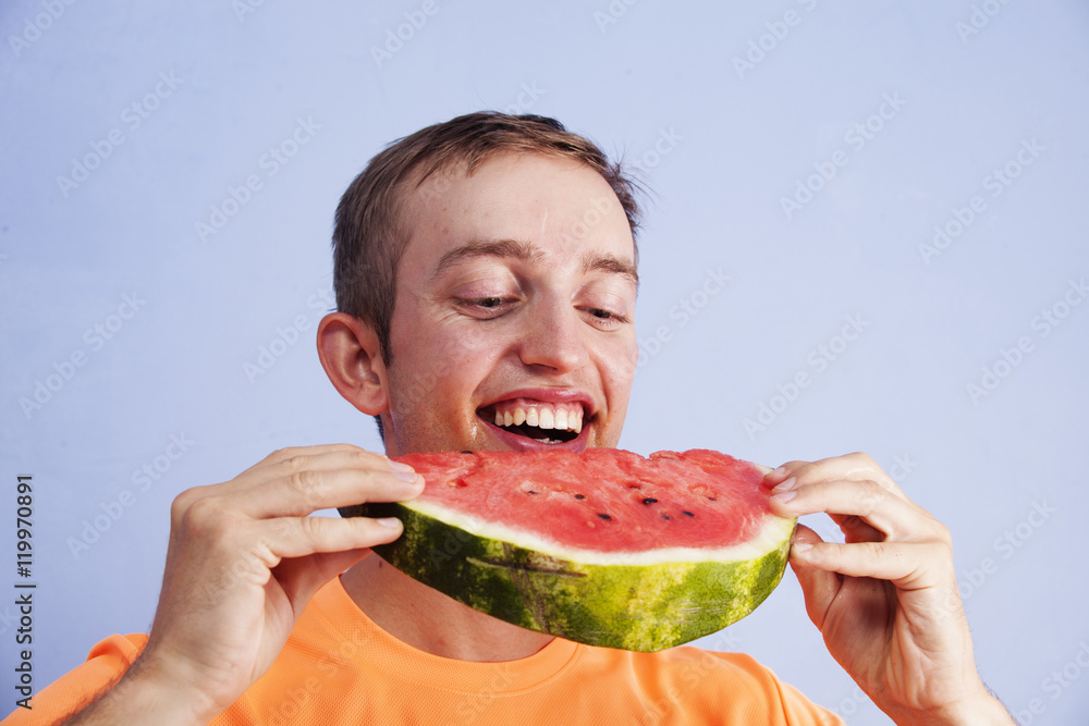 young man eating watermelon Stock Photo | Adobe Stock