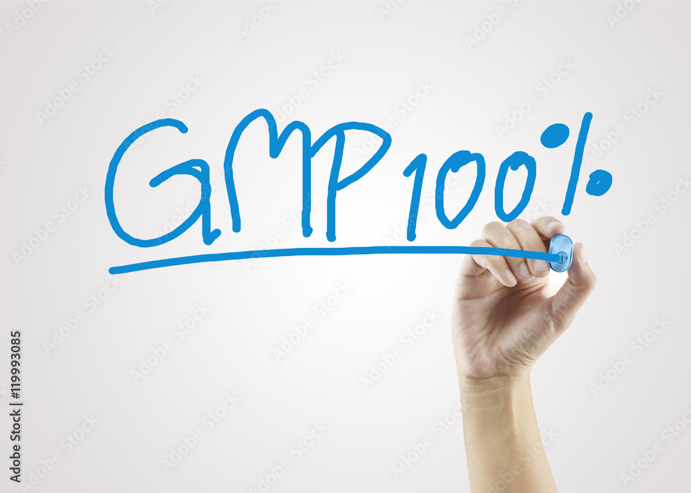 women hand writing GMP 100% word on gray background for business ... women hand writing GMP 100% word on gray background for business ...