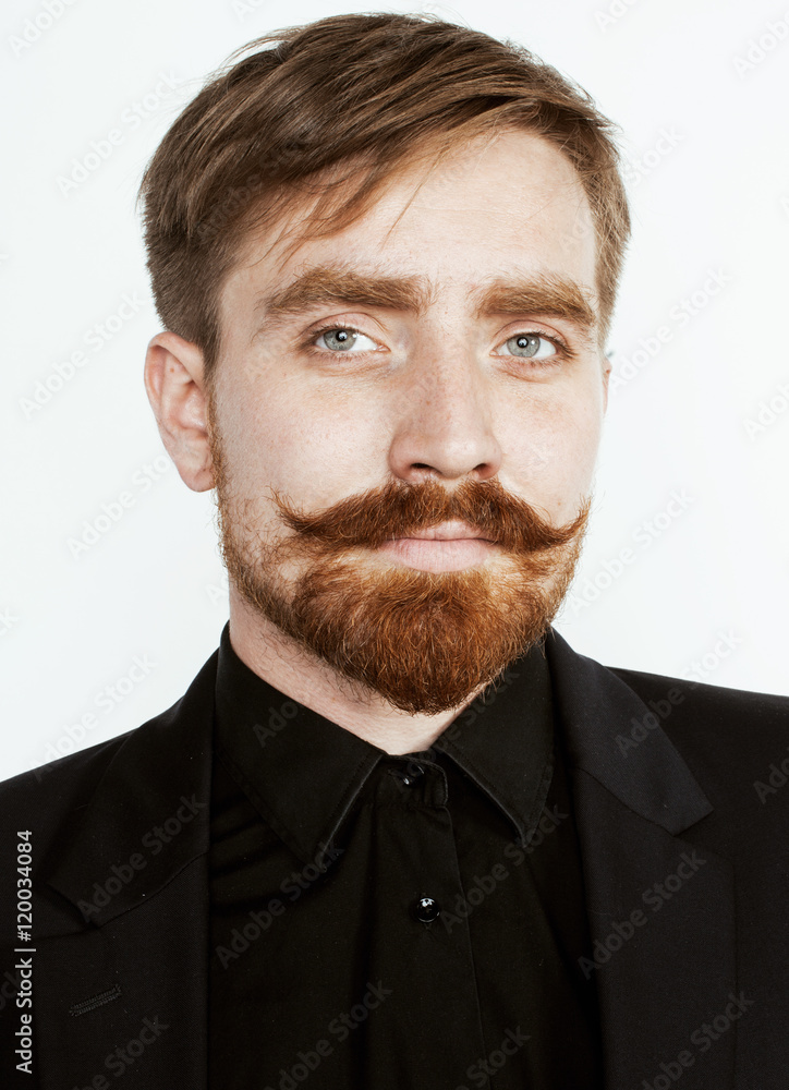 young red hair man with beard and mustache in black suit on white ...