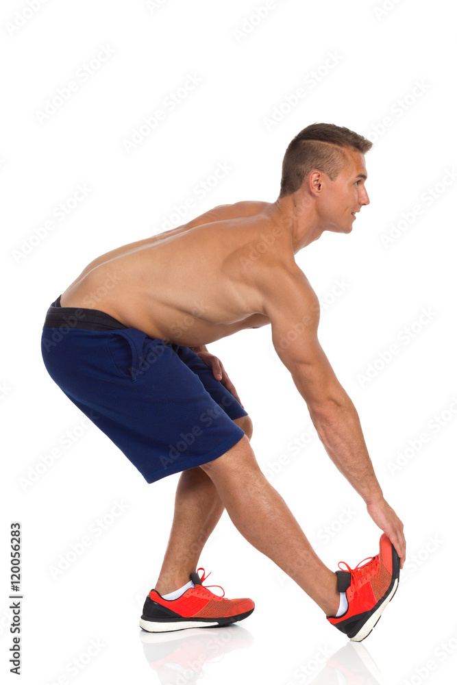 Man Stretching Thigh With Standing Hamstring Stretch Exercise Stock ...