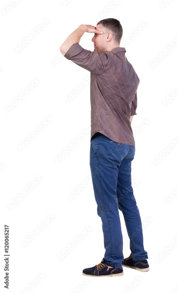 Back view of handsome man in shirt looking up. Standing young guy in ...