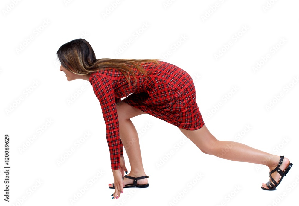 Fotografia do Stock: side view woman start position. girl in red plaid ...