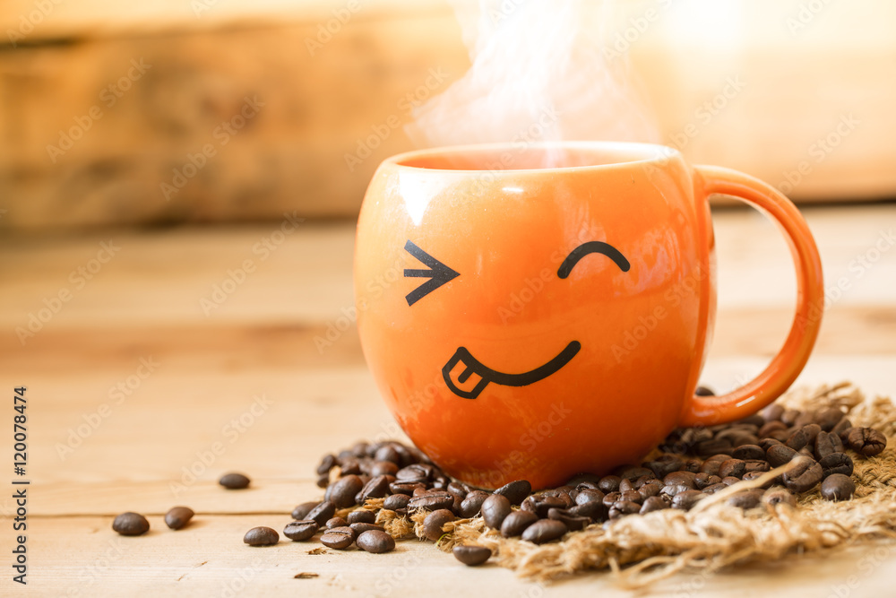 smile face hot coffee cup with bean on wood background, happy coffee ...