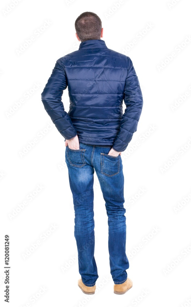 Back view of handsome man in blue windcheater looking. Standing young ...