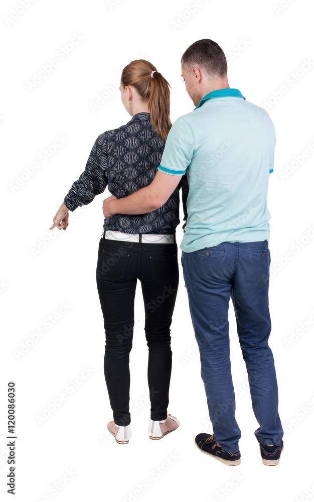 young couple pointing. Back view. Rear view people collection. backside ...