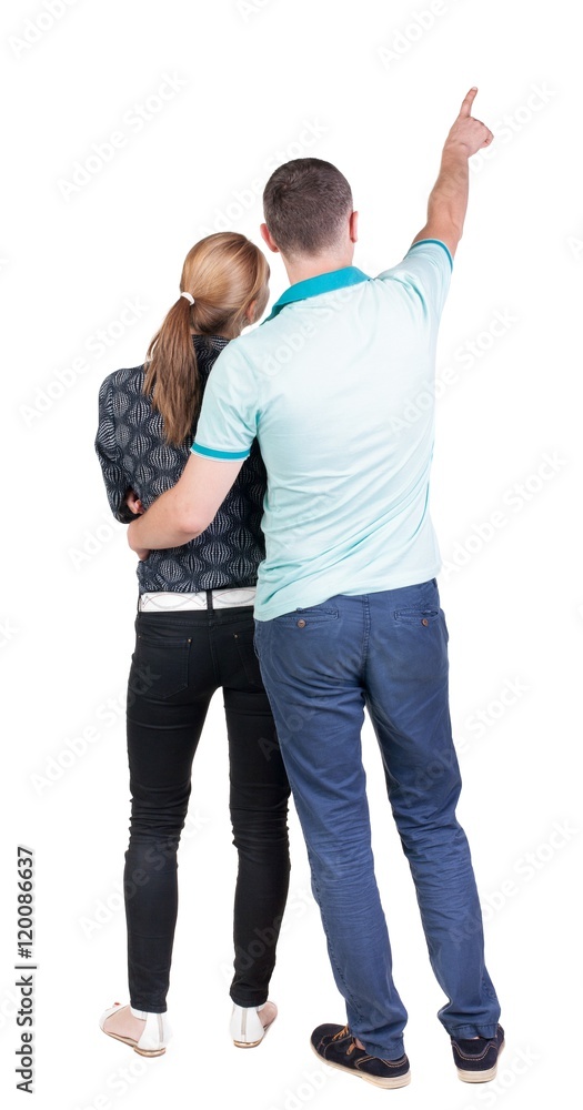 young couple pointing. Back view. Rear view people collection. backside ...