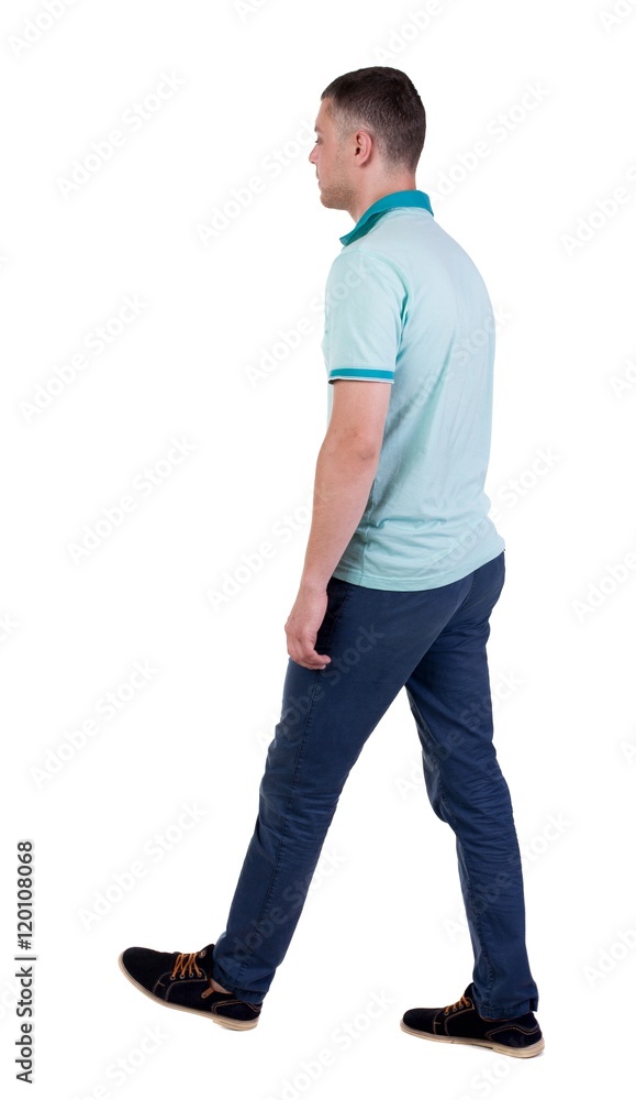 Back view of going handsome man in jeans and a shirt. walking young guy ...