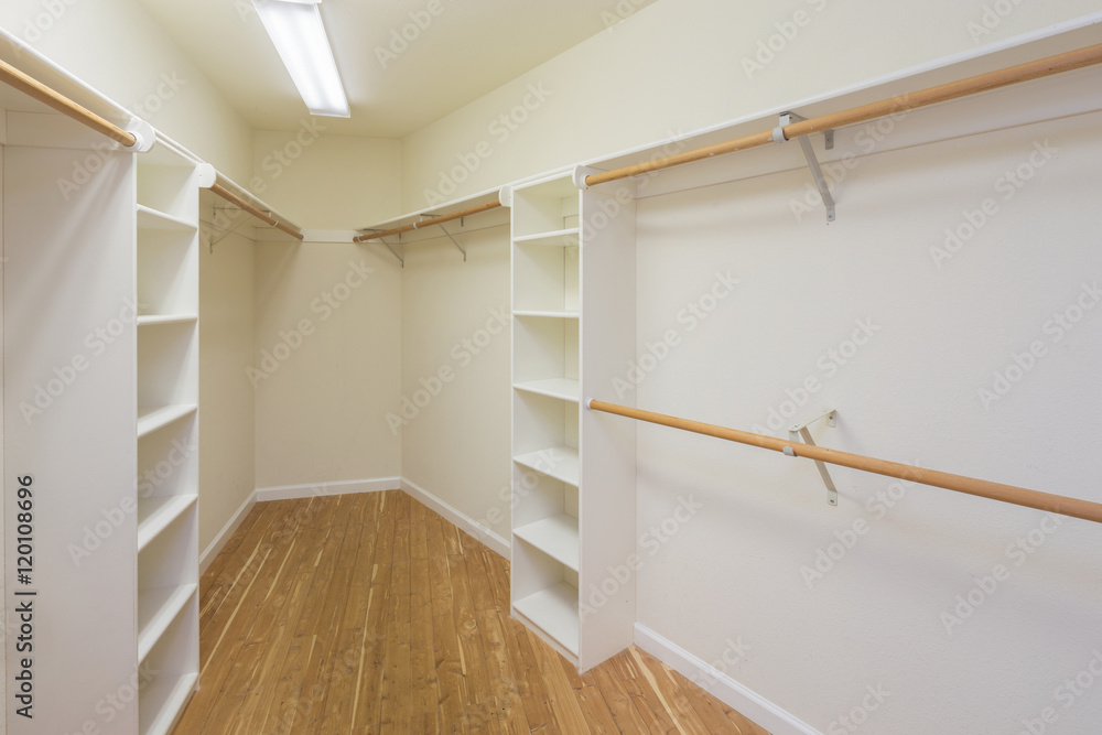 Empty Walk In Closet in white with wooden floor. Stock Photo | Adobe Stock