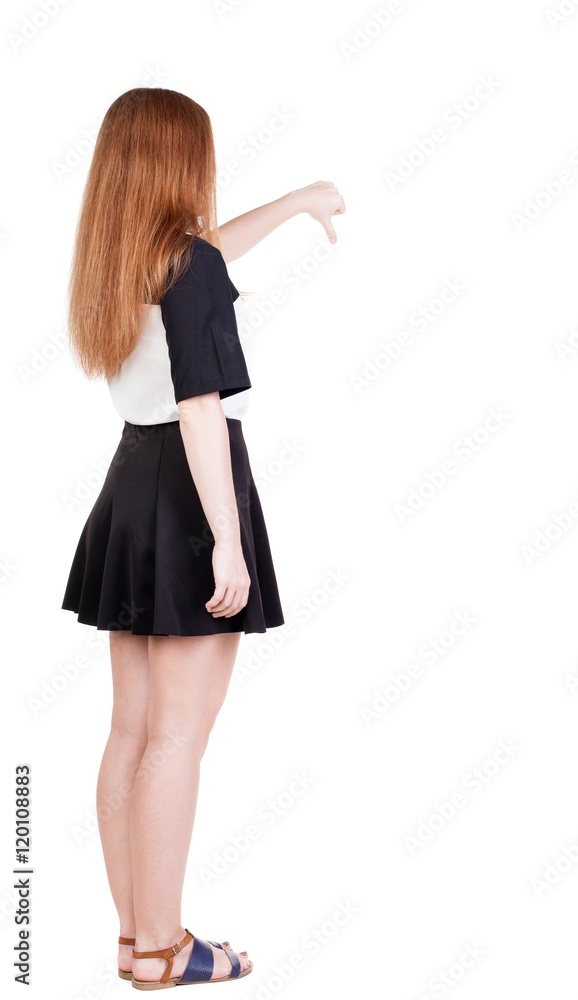 Back view of dissatisfied woman thumbs down. Rear view people ...