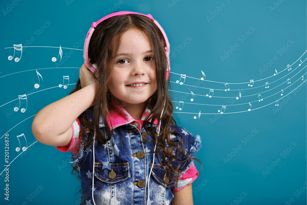 Little cute girl listening music. Musical notes design on blue ...