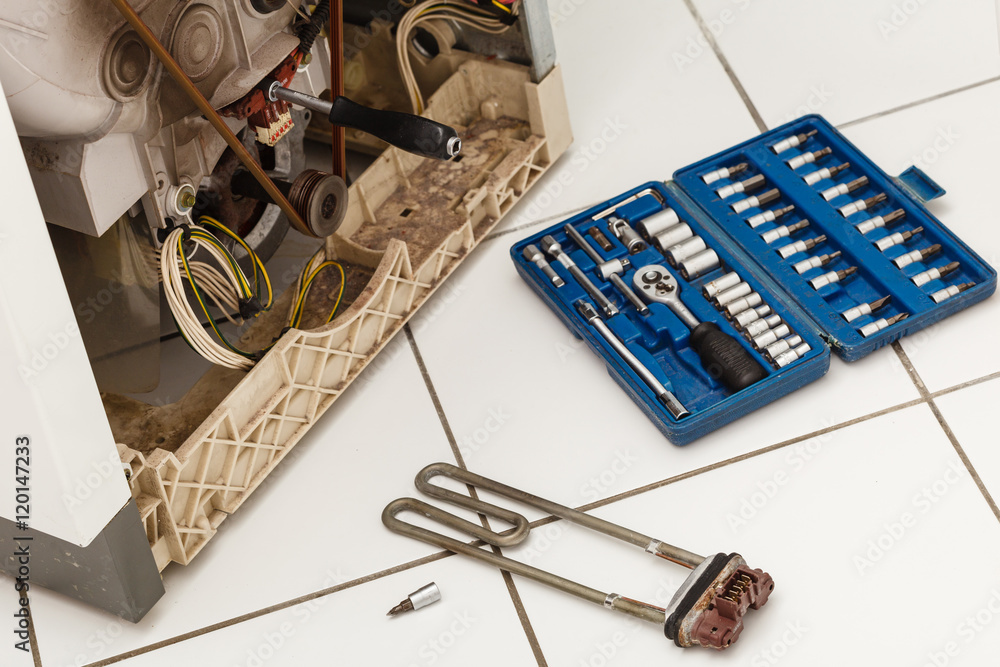 Washing machine during repair. Stock Photo | Adobe Stock