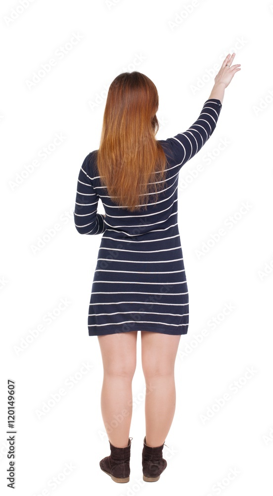Back view of pointing woman. beautiful girl. Rear view people ...