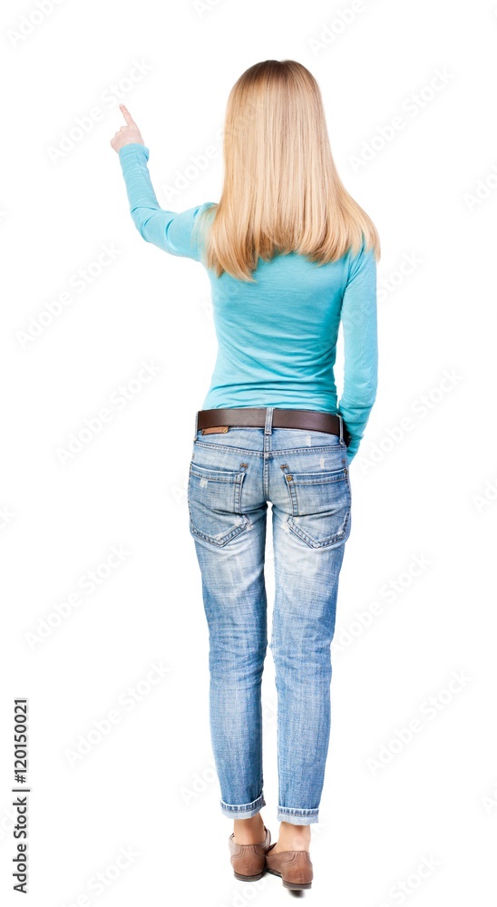 Back view of pointing woman. beautiful girl. Rear view people ...