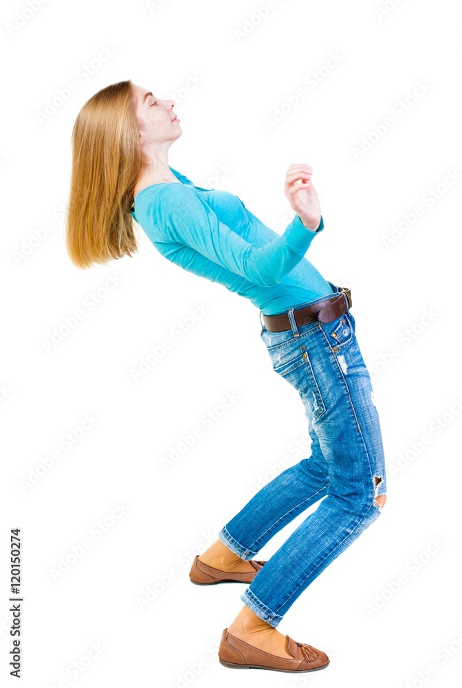 Balancing young woman. or dodge falling woman. Rear view people ...
