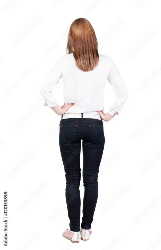 back view of standing young beautiful brunette woman. girl watching ...