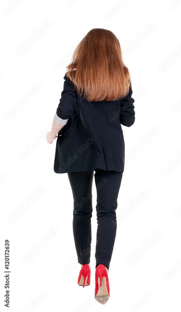 running business woman. back view. going young girl in suit. Rear view ...