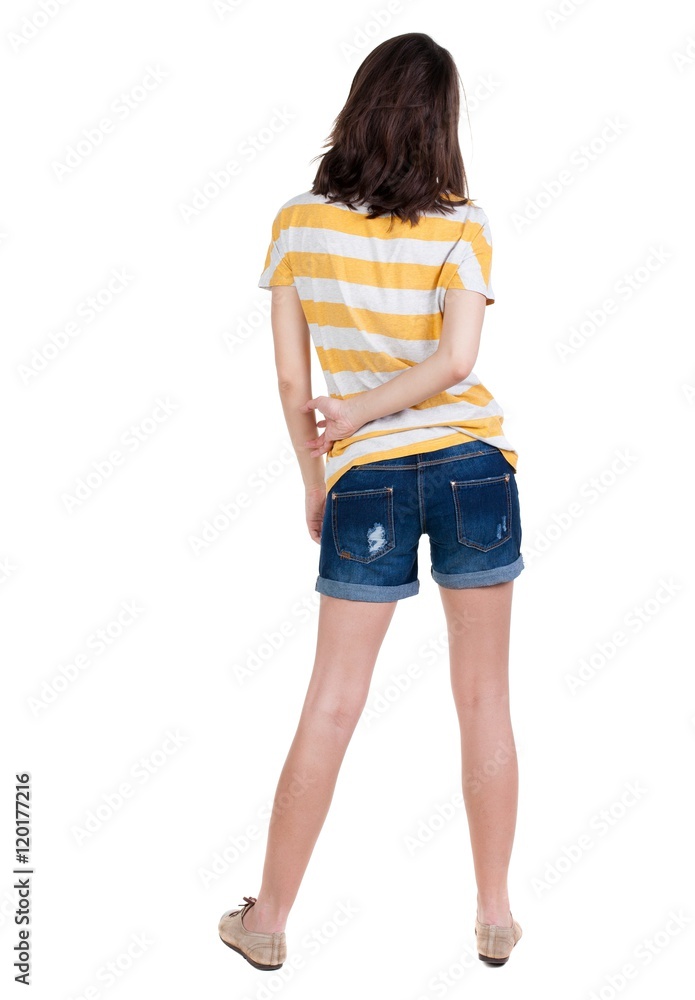 back view of standing young beautiful brunette woman in yellow t-shirt ...