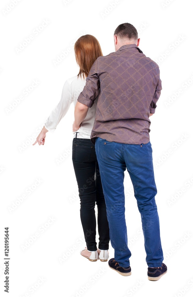 young couple pointing. Back view. Rear view people collection. backside ...