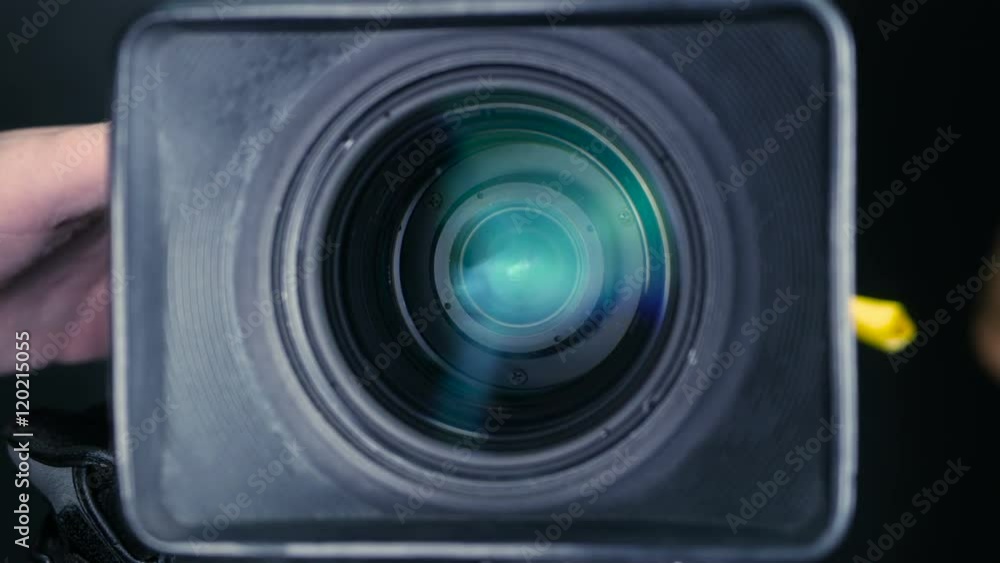 Studio camera. Cameraman changing camera settings focal length ...