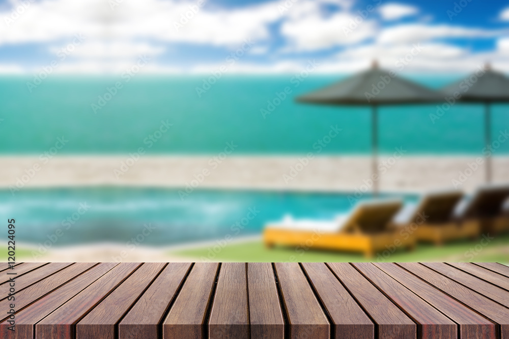 Wood table top on blur beach background with beach chairs and pa Stock ...