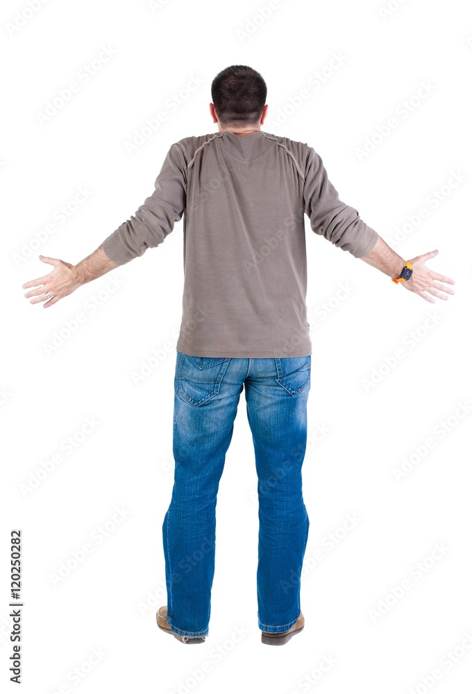 Back view of shocked and scared young man. Rear view. Isolated over ...