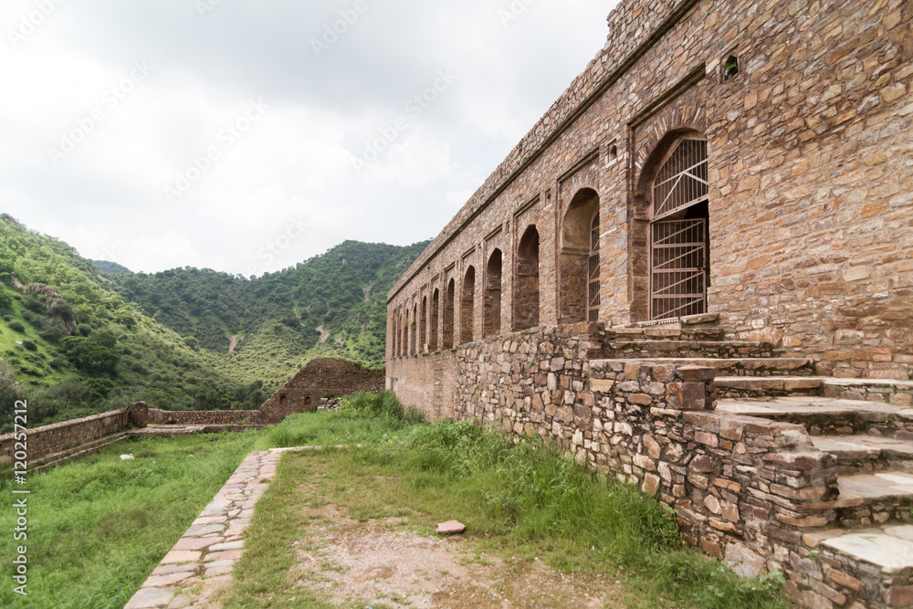 The historical ruins of the now famous Bhangarh Fort with ruins of ...