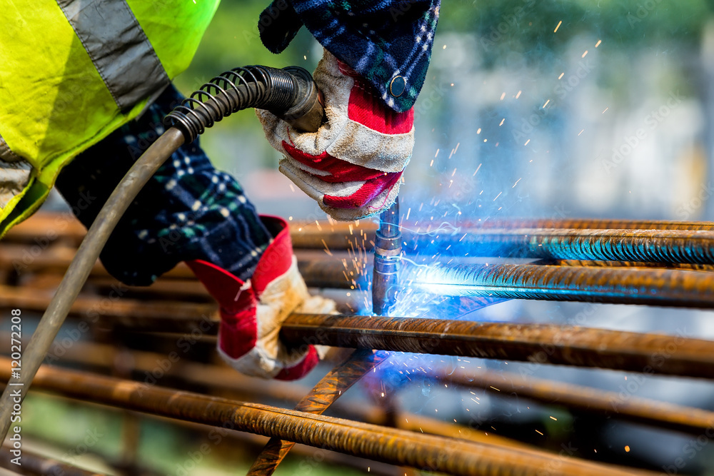 Close up of the hands welder worker with electrode Stock Photo | Adobe ...